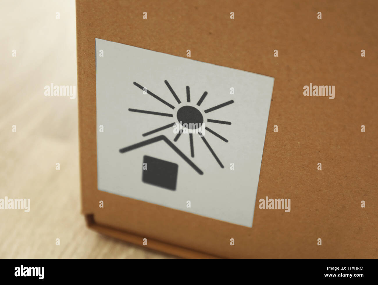 Carton boxes with warning sign, closeup Stock Photo - Alamy