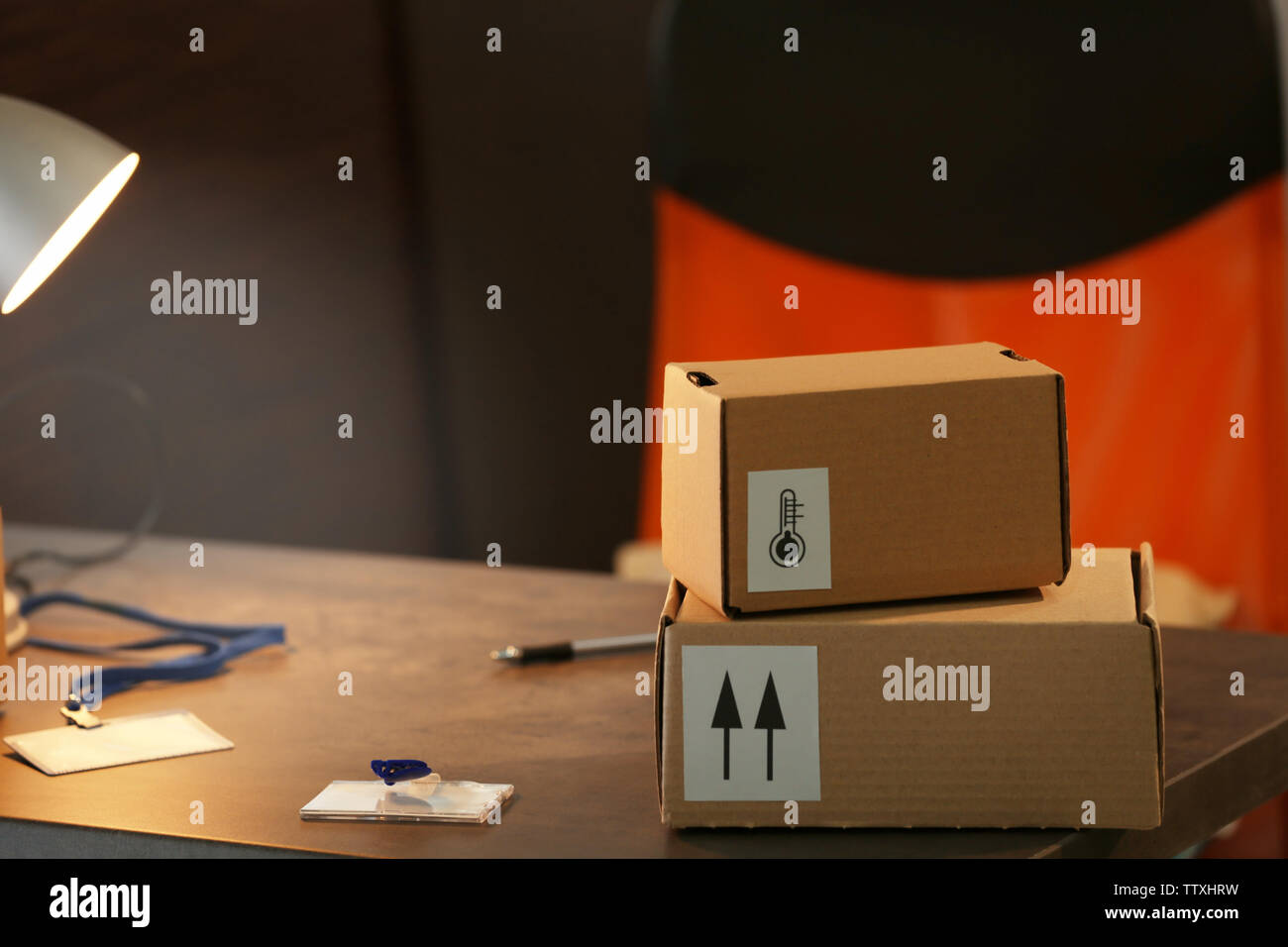 Carton boxes on table in room Stock Photo - Alamy