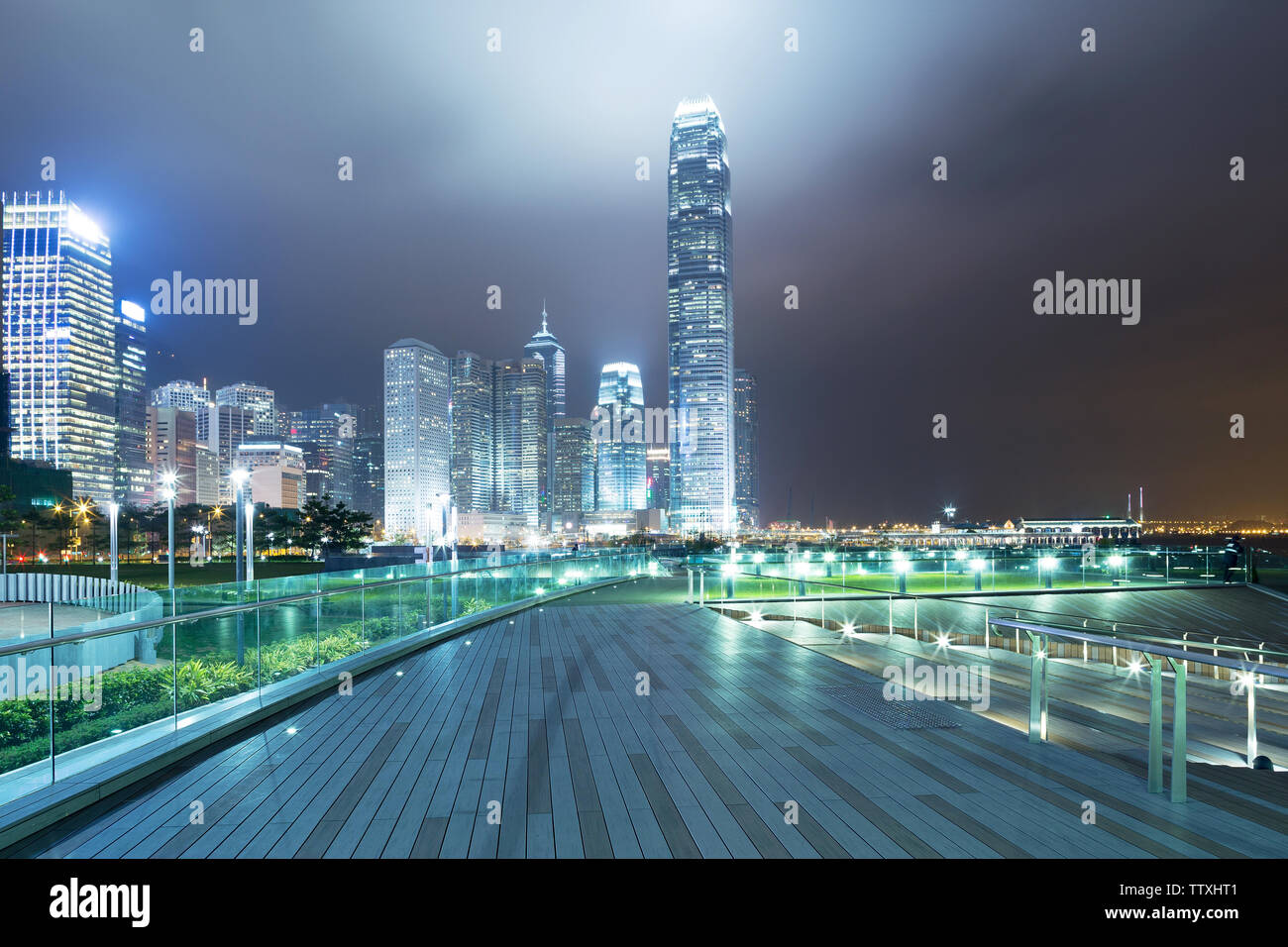 pathway in the night with modern city background Stock Photo - Alamy