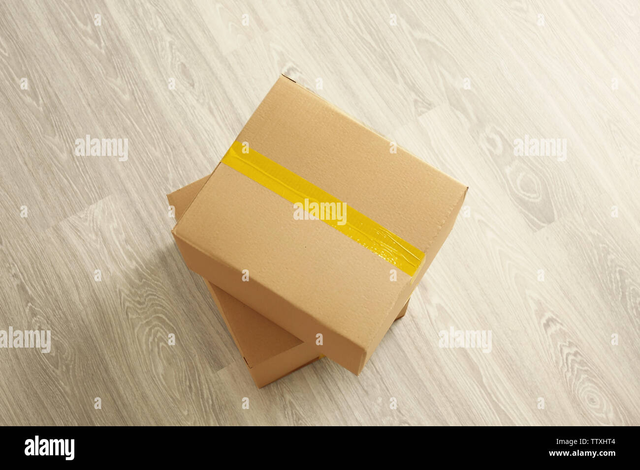 Carton boxes on floor Stock Photo - Alamy
