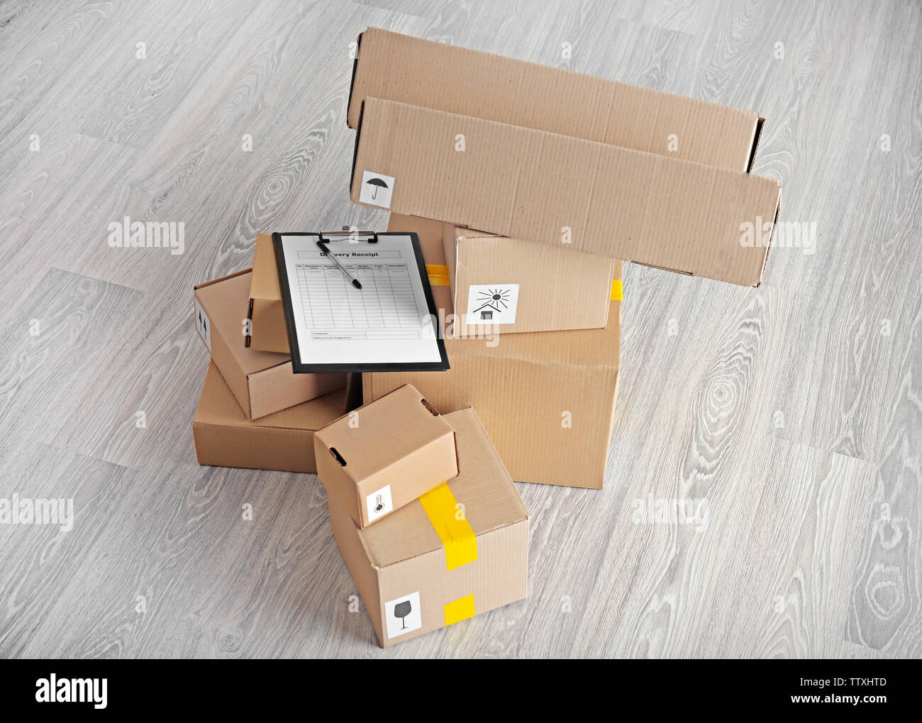 Carton boxes on floor Stock Photo - Alamy