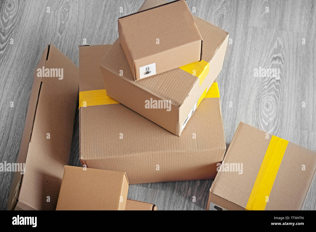 Carton boxes on floor Stock Photo - Alamy