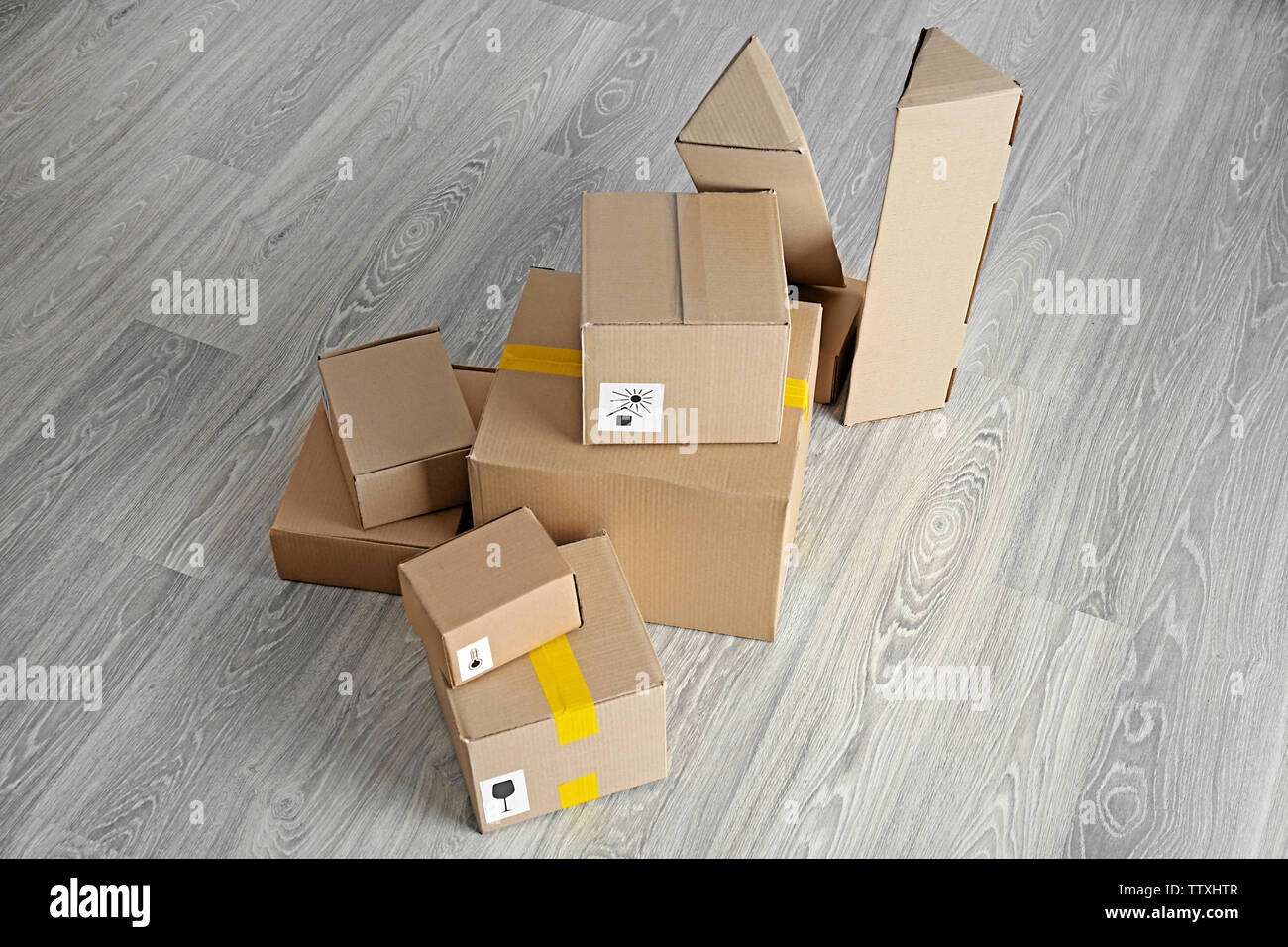 Carton boxes on floor Stock Photo - Alamy