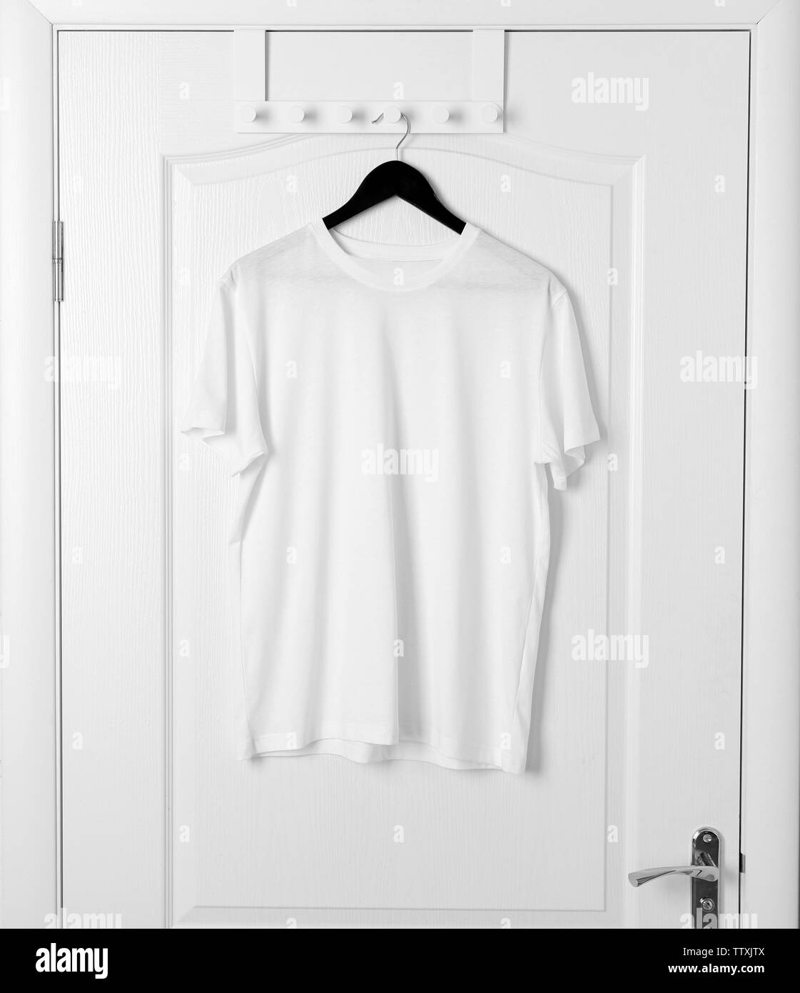 White door hanger on Black and White Stock Photos & Images - Alamy