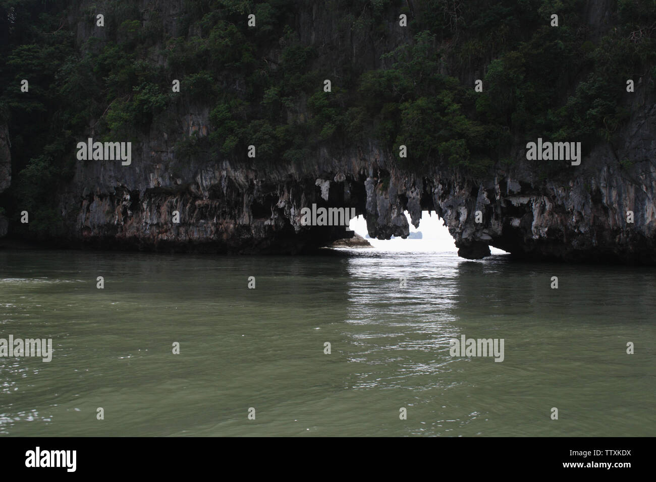 Natural arch in a cliff, Panak Island, Phang Nga Bay, Phuket, Thailand ...