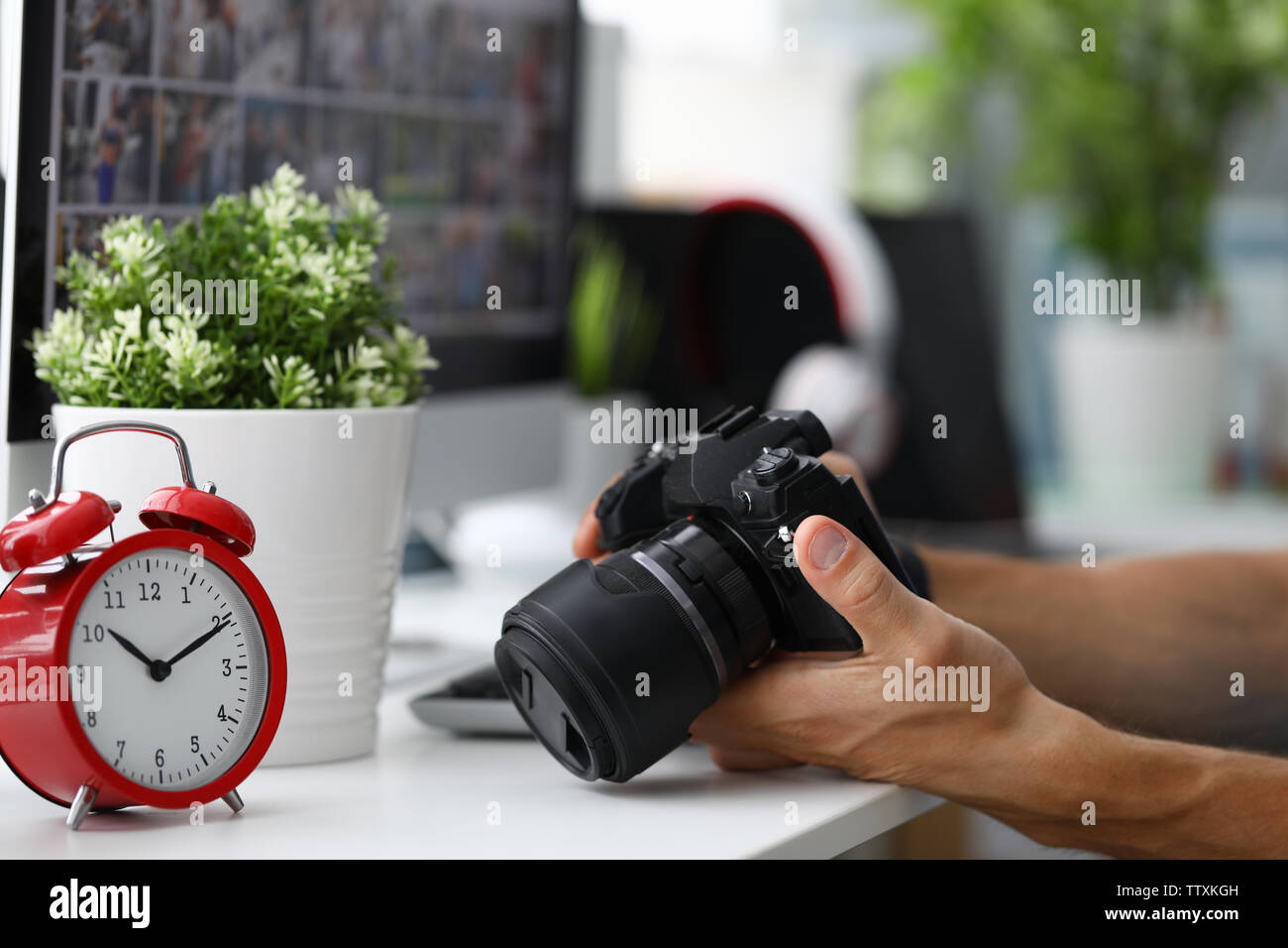 Hand photo camera office. Computer technology Stock Photo - Alamy
