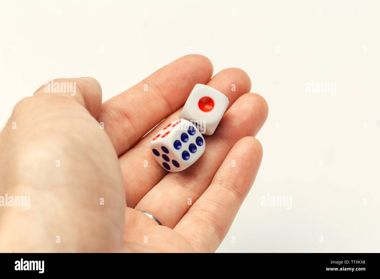 hand with a pair of dice Stock Photo - Alamy
