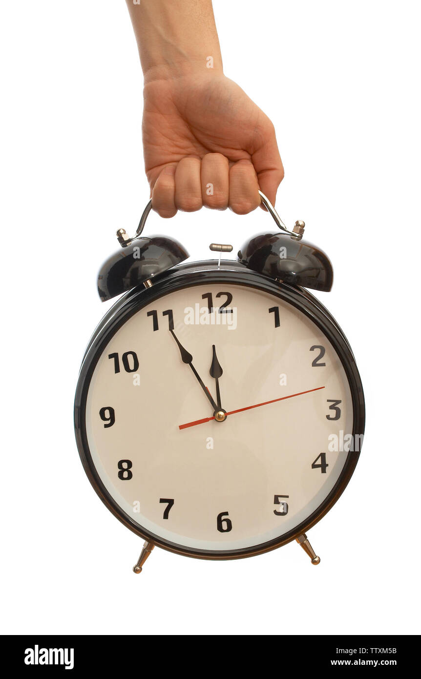 hand holding alarm clock on white background Stock Photo - Alamy