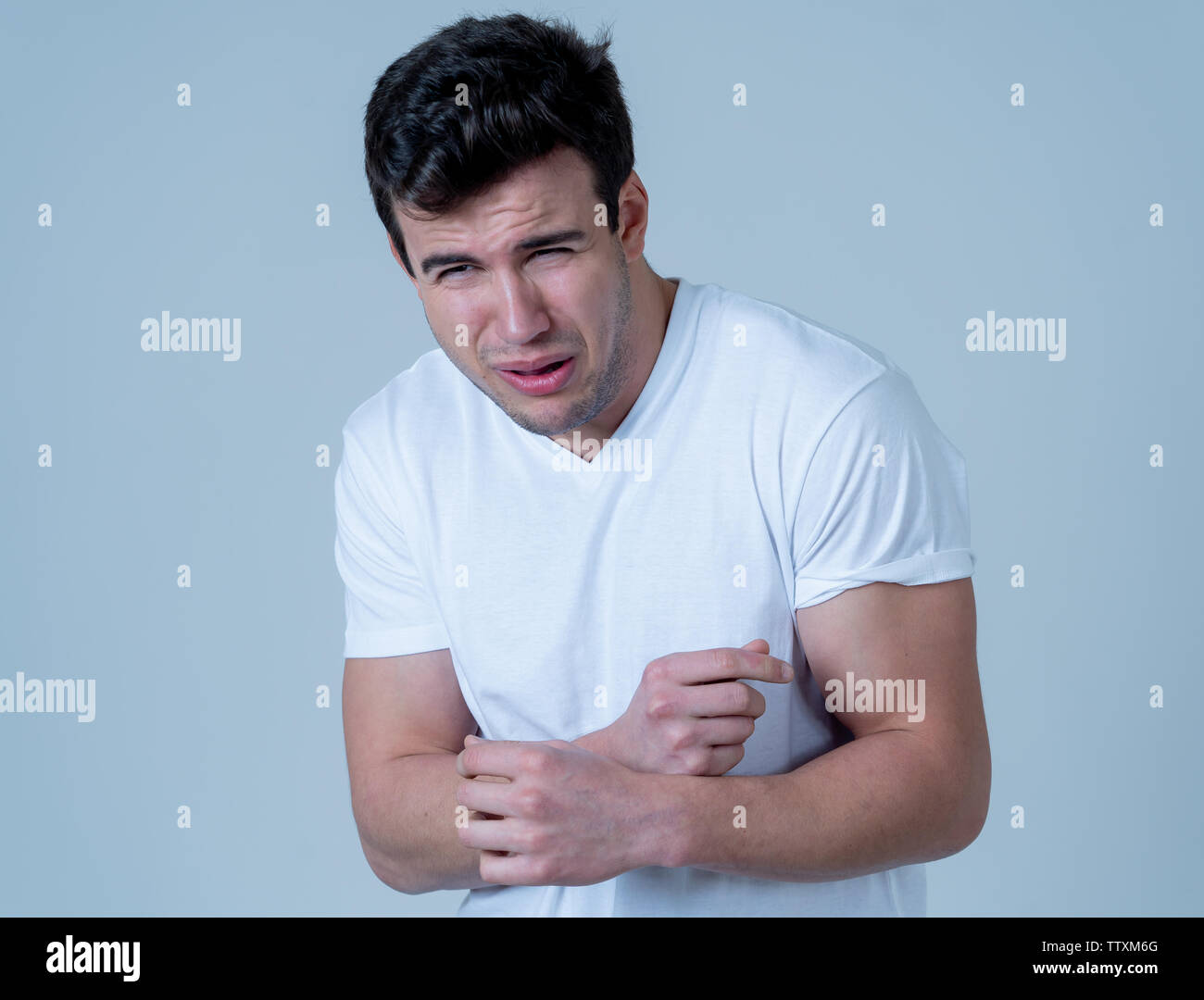 Portrait of Handsome latin young man in shock with a scared expression ...