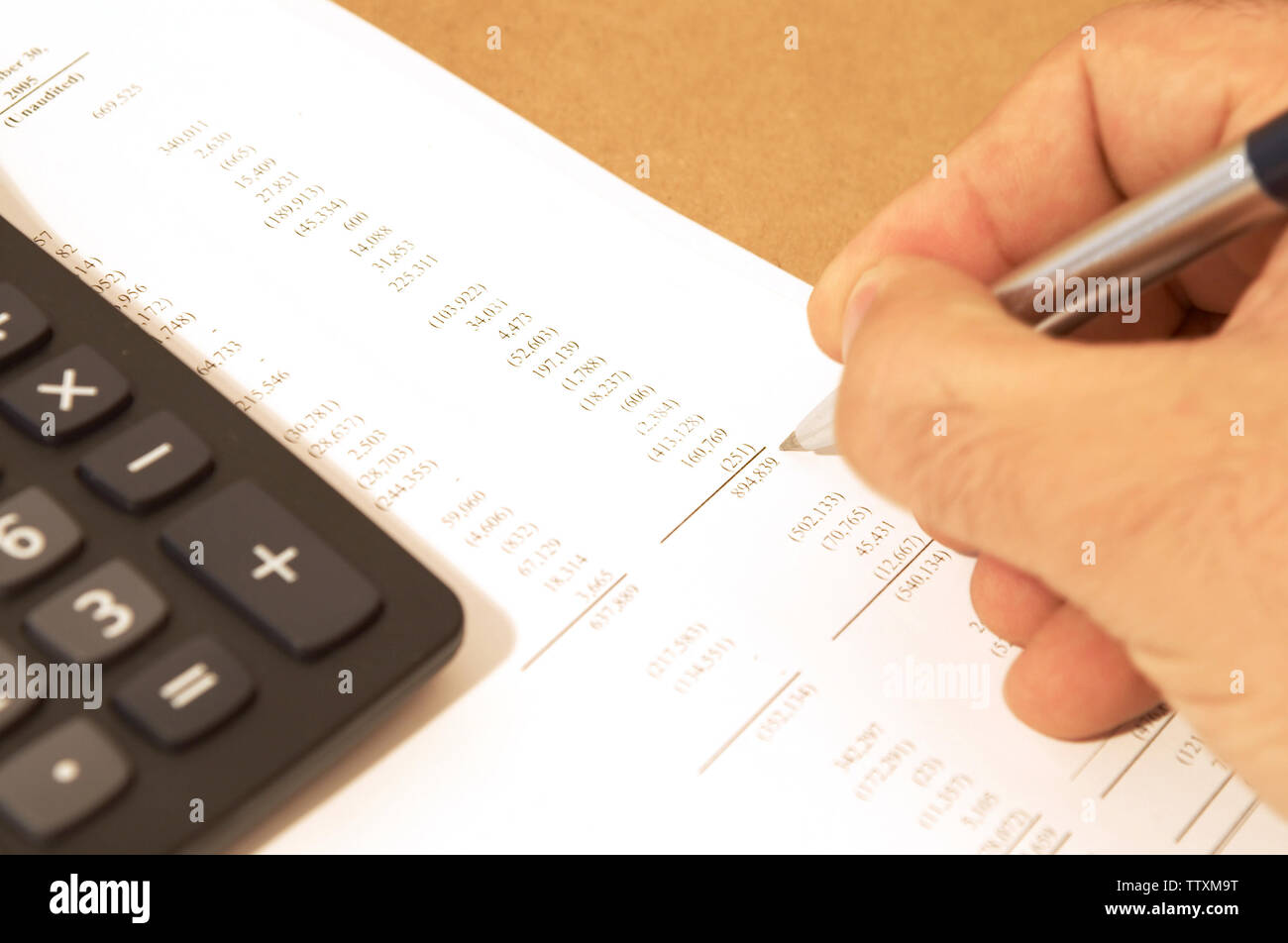 businessman working on finance tables Stock Photo - Alamy