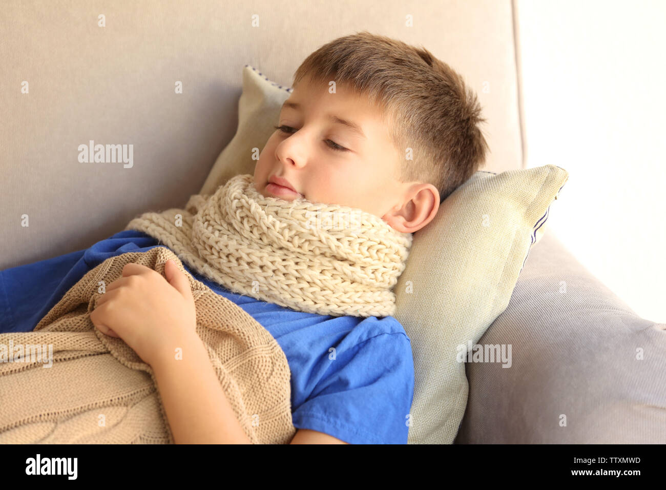 Small sick boy in bed Stock Photo - Alamy