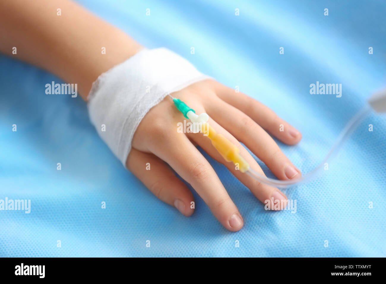 Child hand with catheter on bed Stock Photo - Alamy