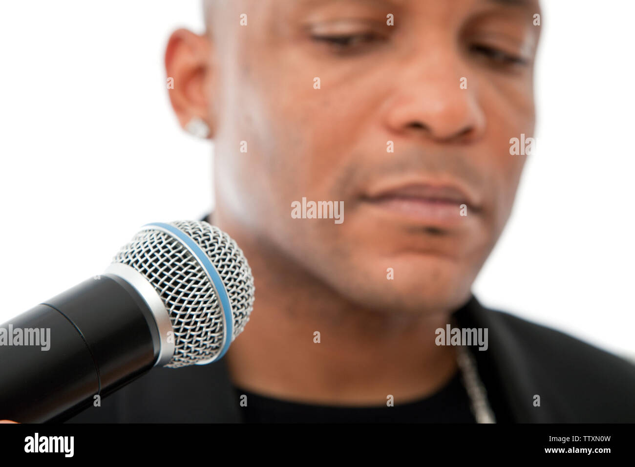African American singer standing on a white background Stock Photo - Alamy