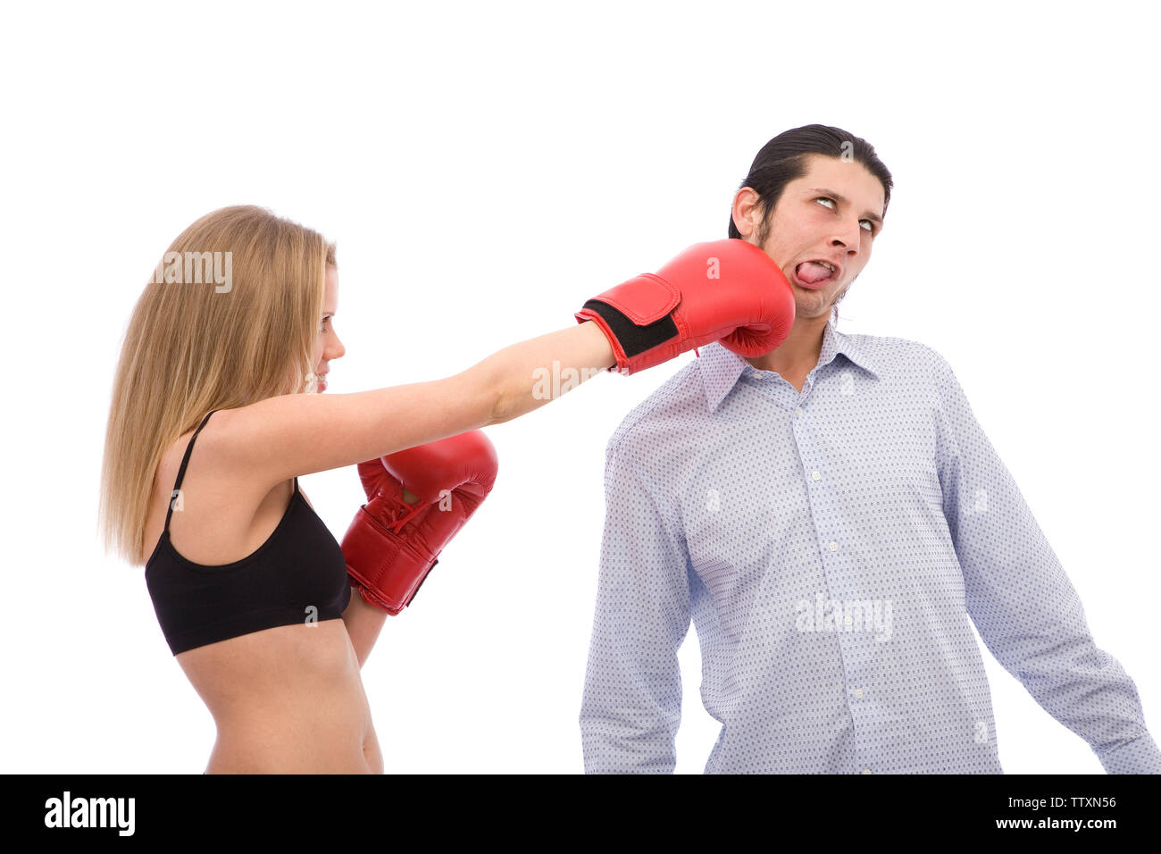 young girl punching a man on white background Stock Photo - Alamy