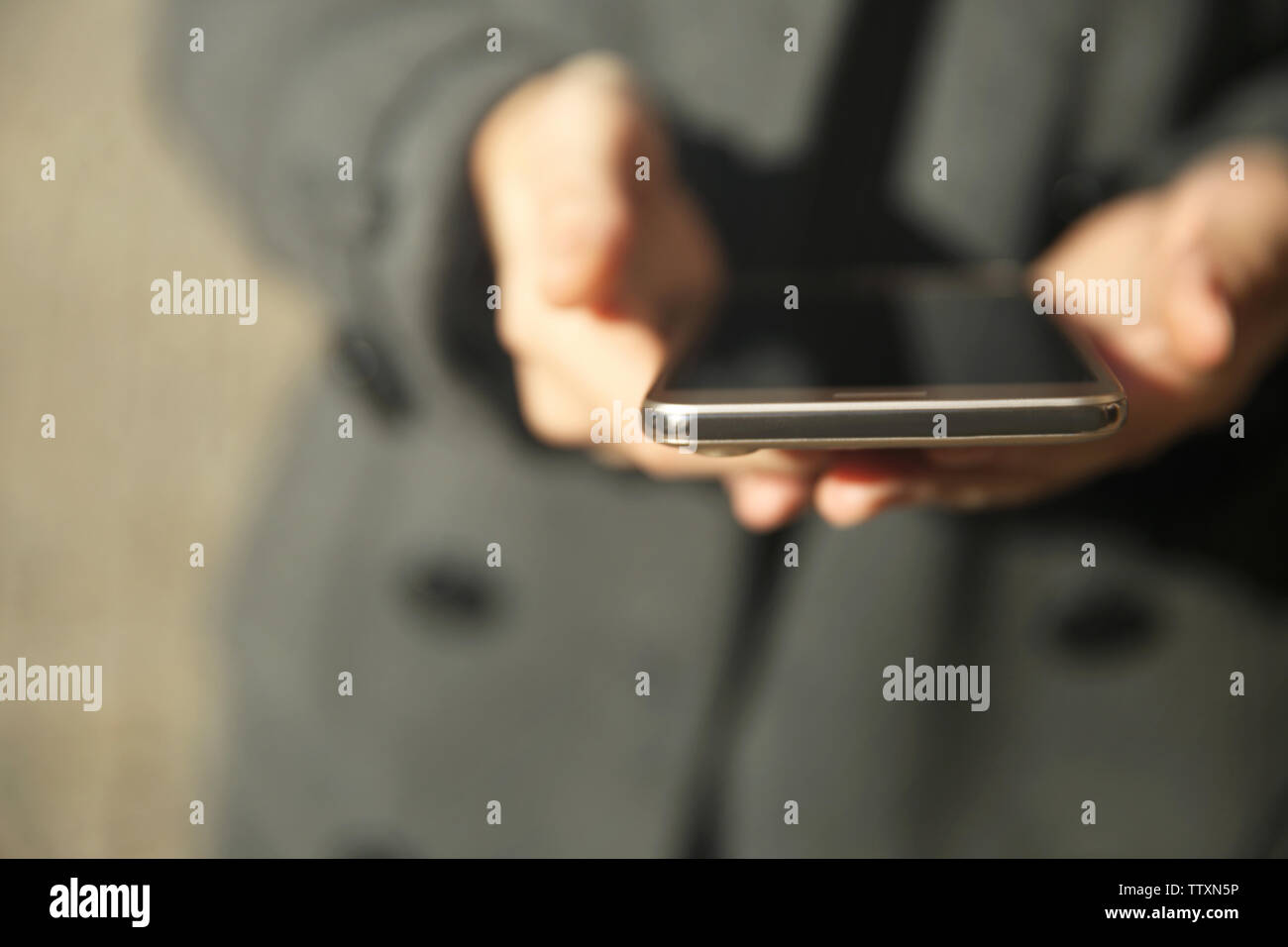 Woman holding modern cellphone, outdoor Stock Photo - Alamy