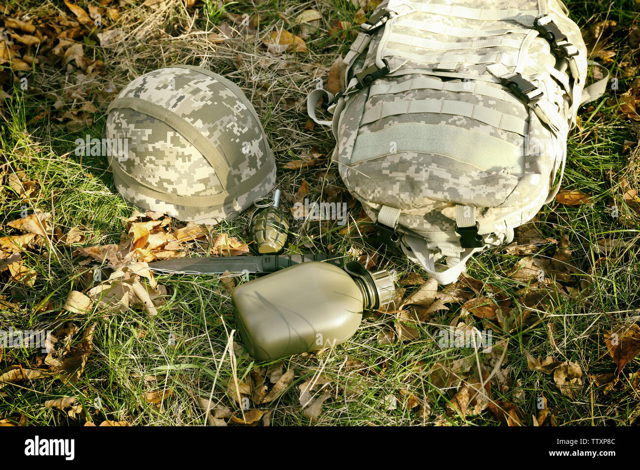 Military set on grass background Stock Photo - Alamy