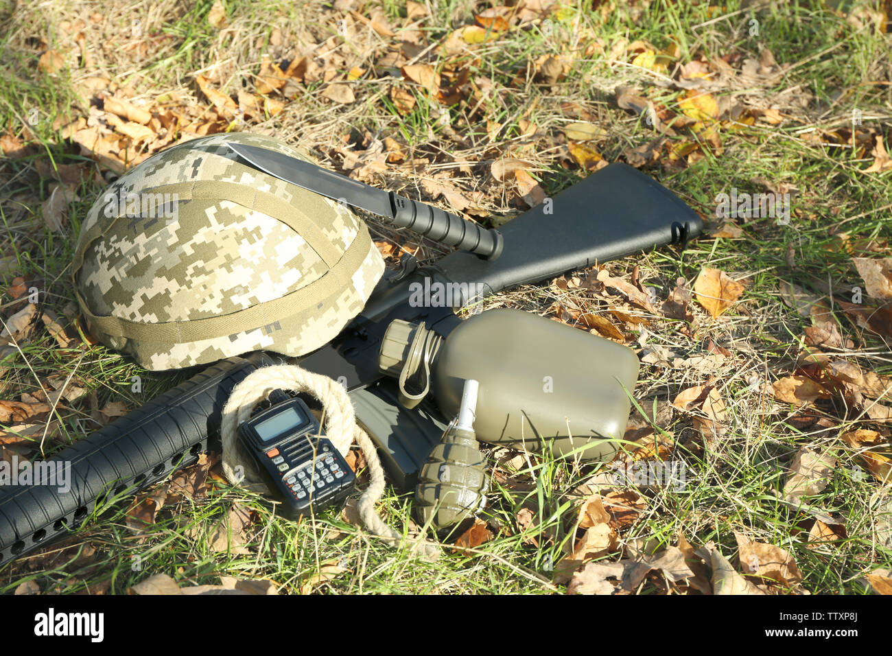Military set on grass background Stock Photo - Alamy