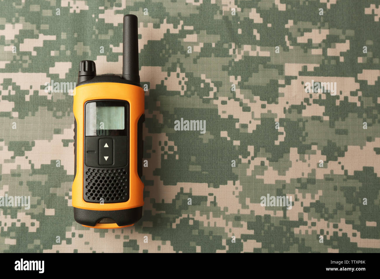 Military radio on camouflage background Stock Photo - Alamy