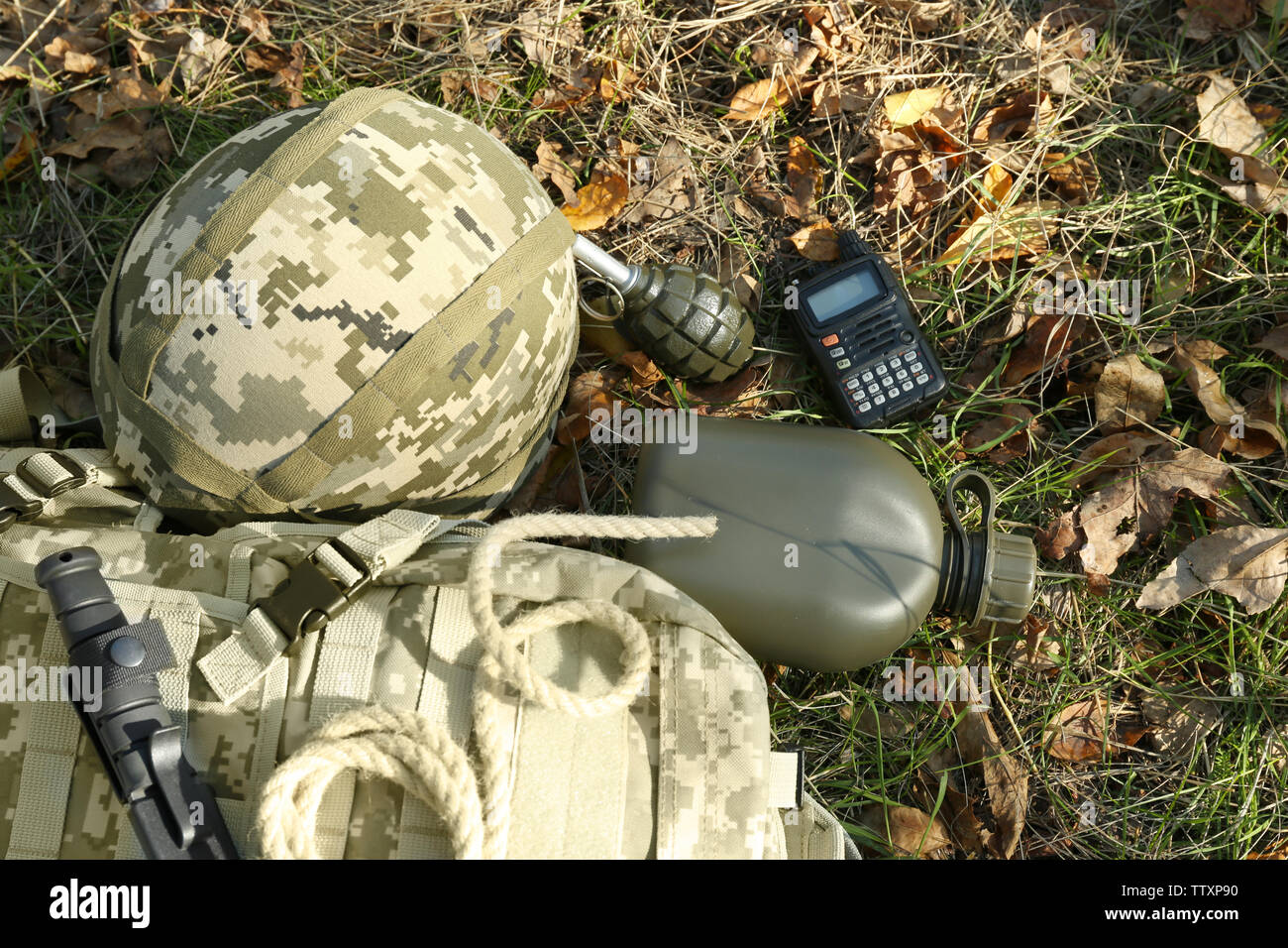 Military set on grass background Stock Photo - Alamy