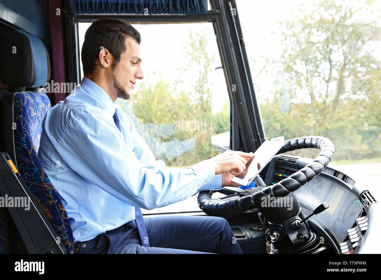 Man in bus with tablet hi-res stock photography and images - Alamy