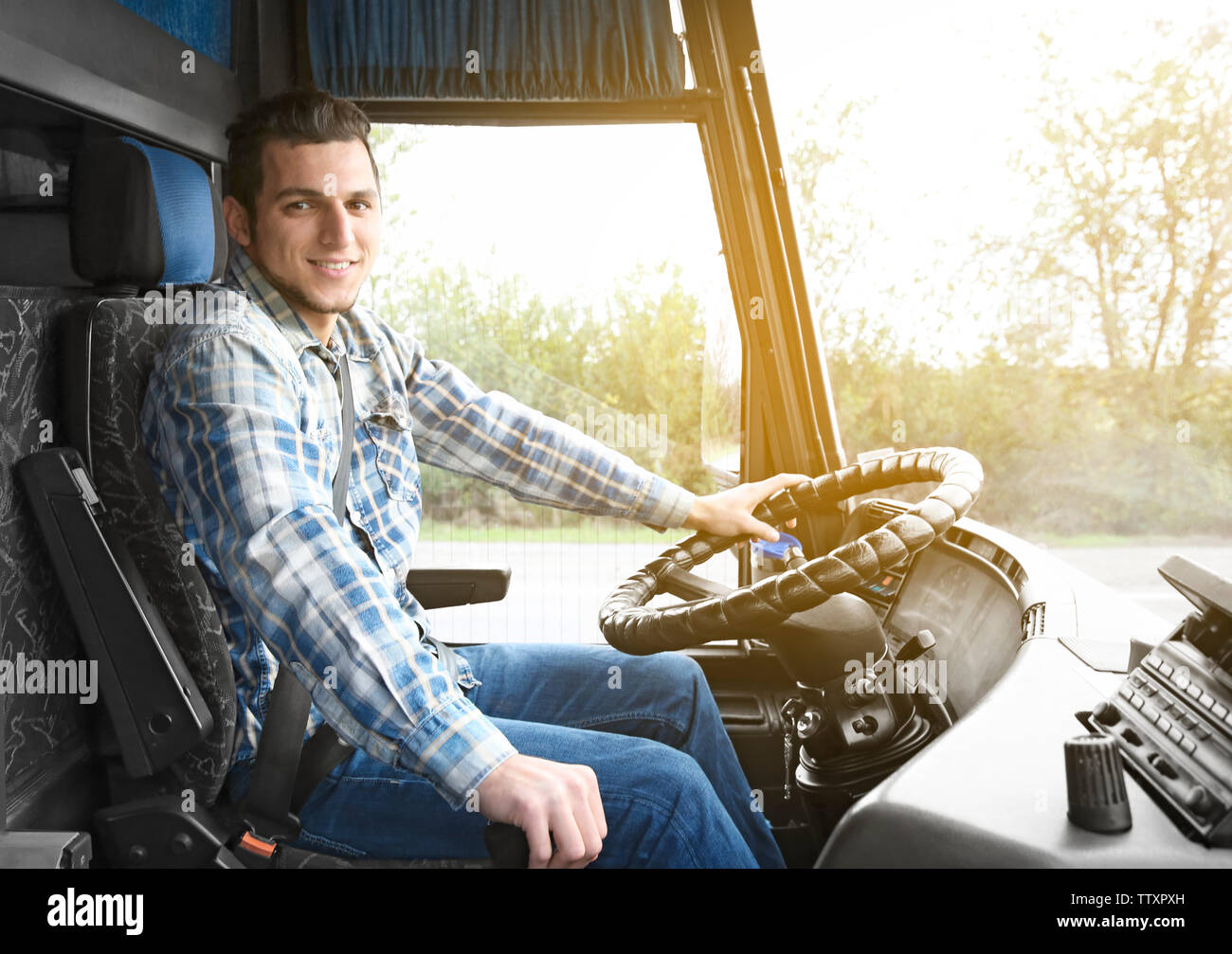 Bus driver sitting in bus hi-res stock photography and images - Alamy
