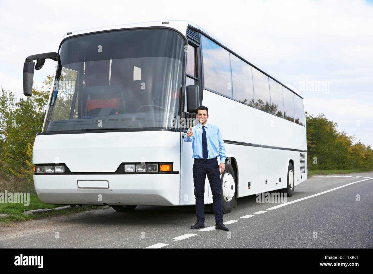 Man standing in front of bus hi-res stock photography and images - Alamy