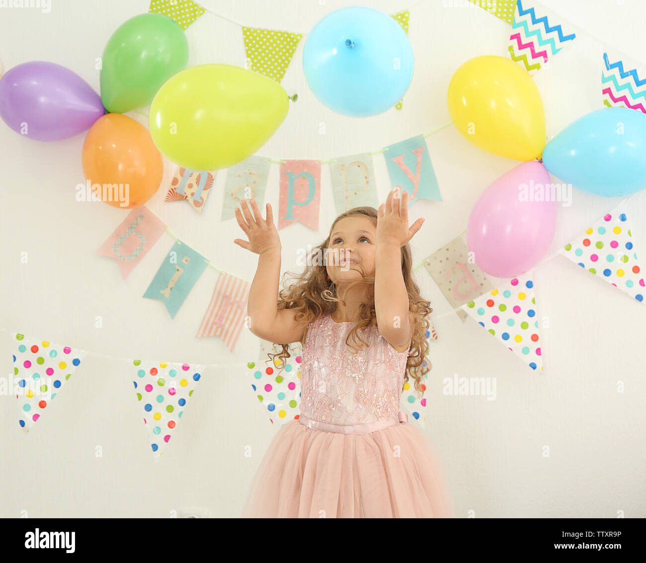 Pretty birthday girl having fun at home Stock Photo - Alamy