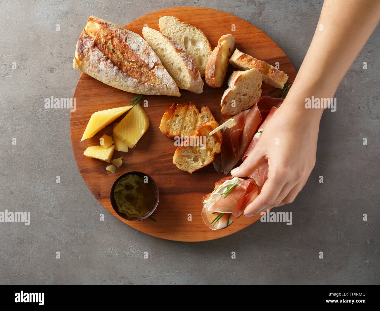 Female hand with tasty bruschetta, top view Stock Photo - Alamy