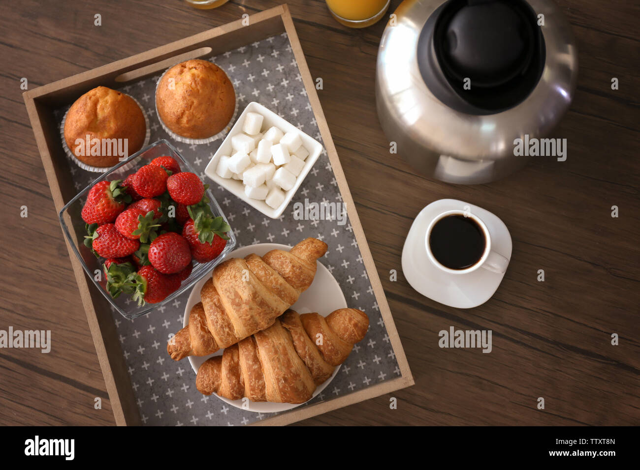 Breakfast with croissant and coffee on wooden table Stock Photo - Alamy
