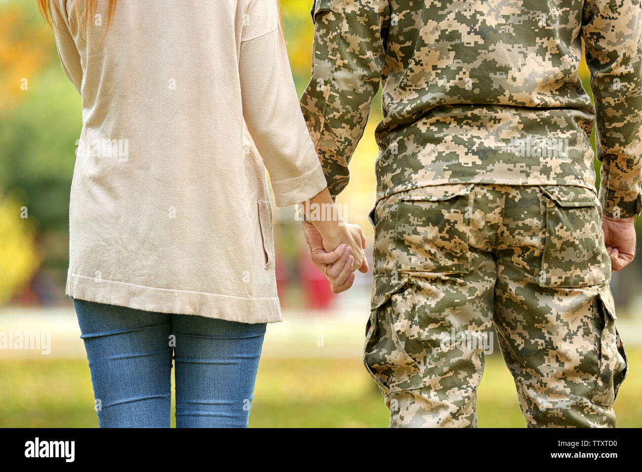 Soldier reunited with wife, closeup Stock Photo - Alamy