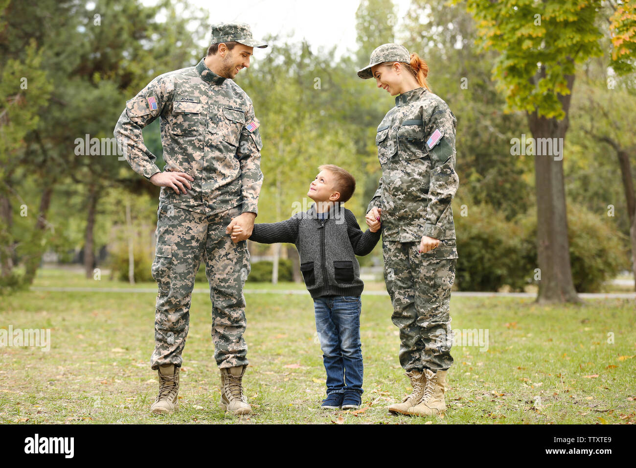 Military family reunited on a sunny day Stock Photo - Alamy