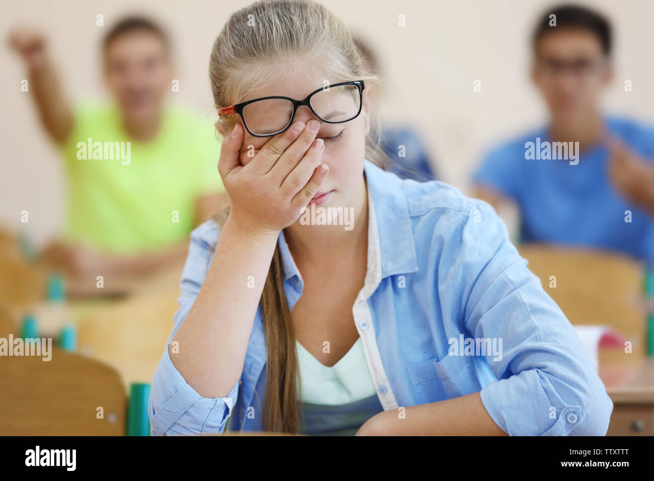 Student with group of classmates in classroom Stock Photo - Alamy