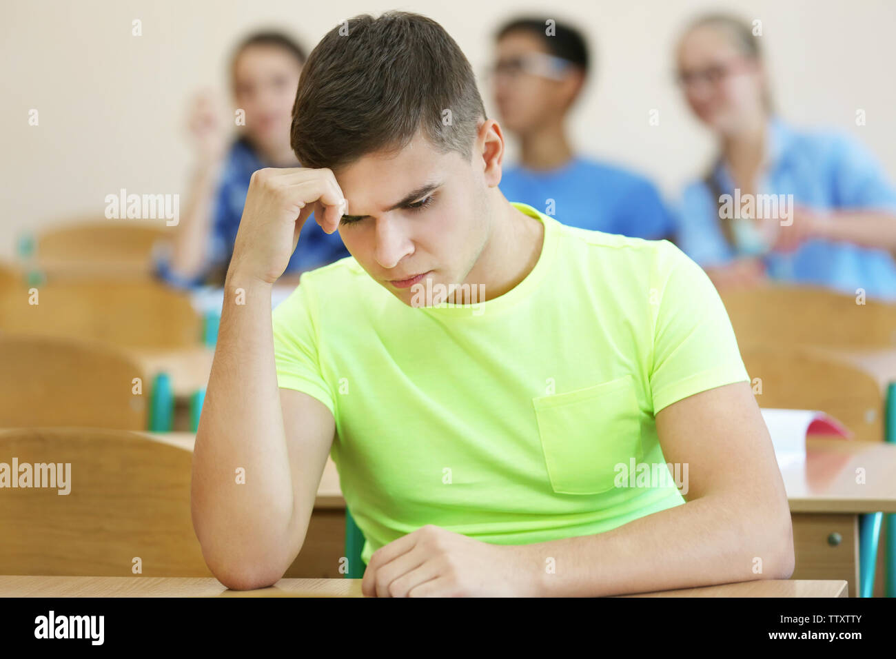 Student with group of classmates in classroom Stock Photo - Alamy