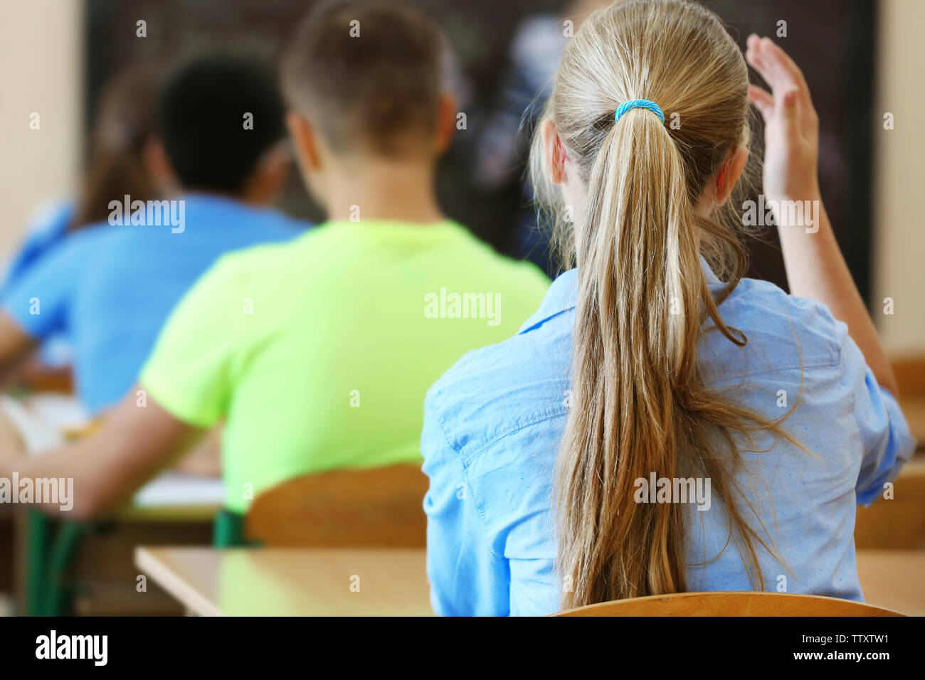 Student with group of classmates in classroom Stock Photo - Alamy