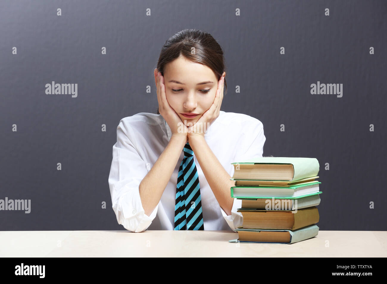 Student tired of studying in classroom Stock Photo - Alamy
