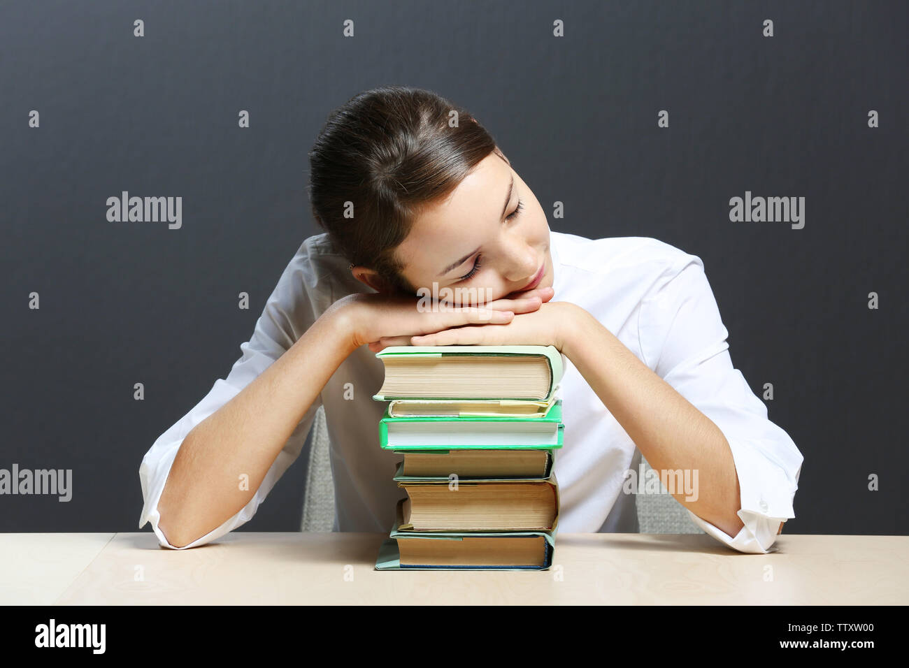 Student tired of studying in classroom Stock Photo - Alamy