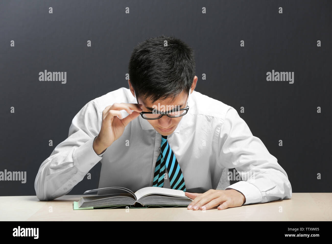 Student studying in classroom Stock Photo - Alamy
