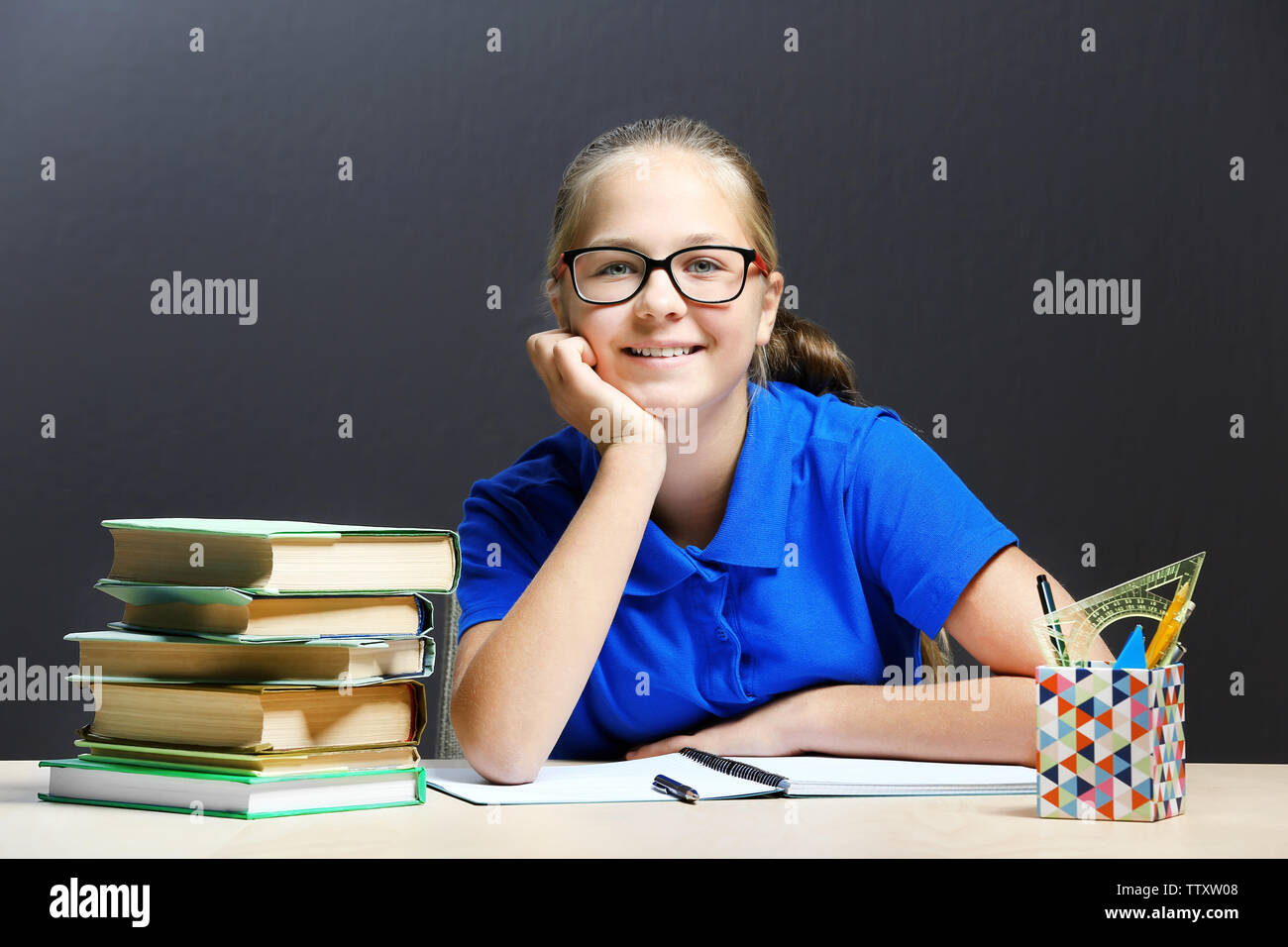 Student studying in classroom Stock Photo - Alamy
