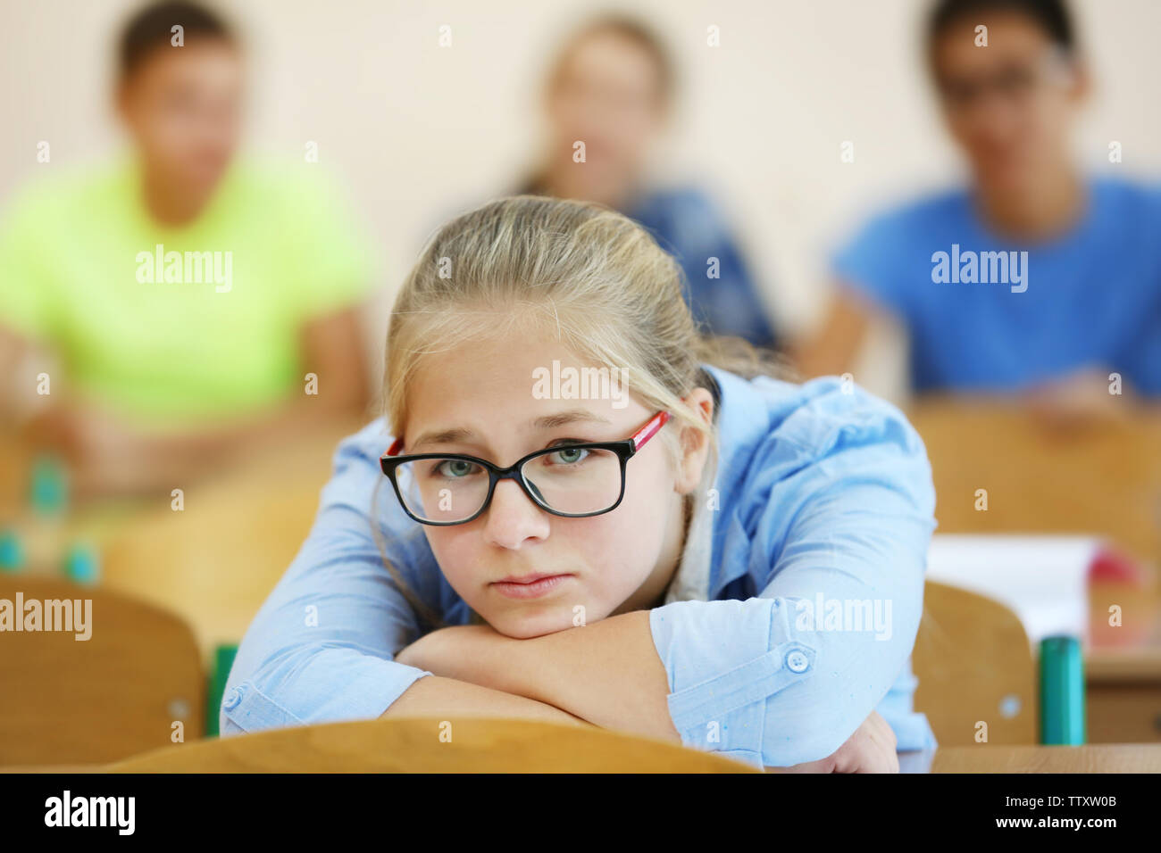 Student with group of classmates in classroom Stock Photo - Alamy