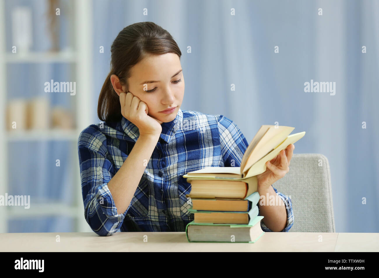Student doing homework at home Stock Photo - Alamy