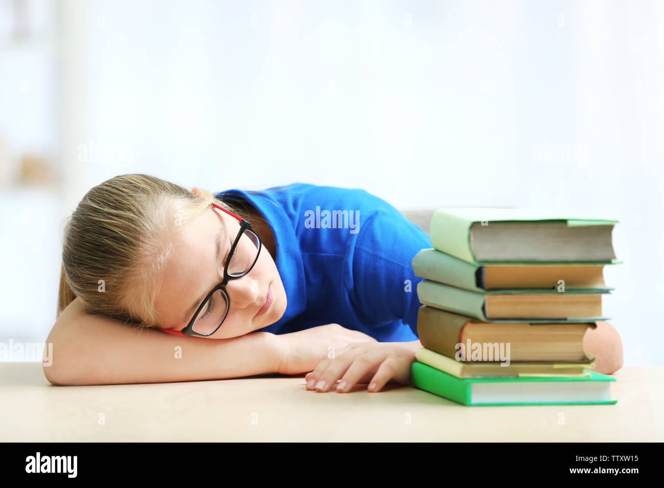 Student tired of studying in classroom Stock Photo - Alamy