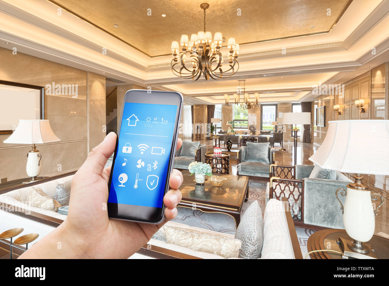 Mobile phone in smart home Stock Photo - Alamy