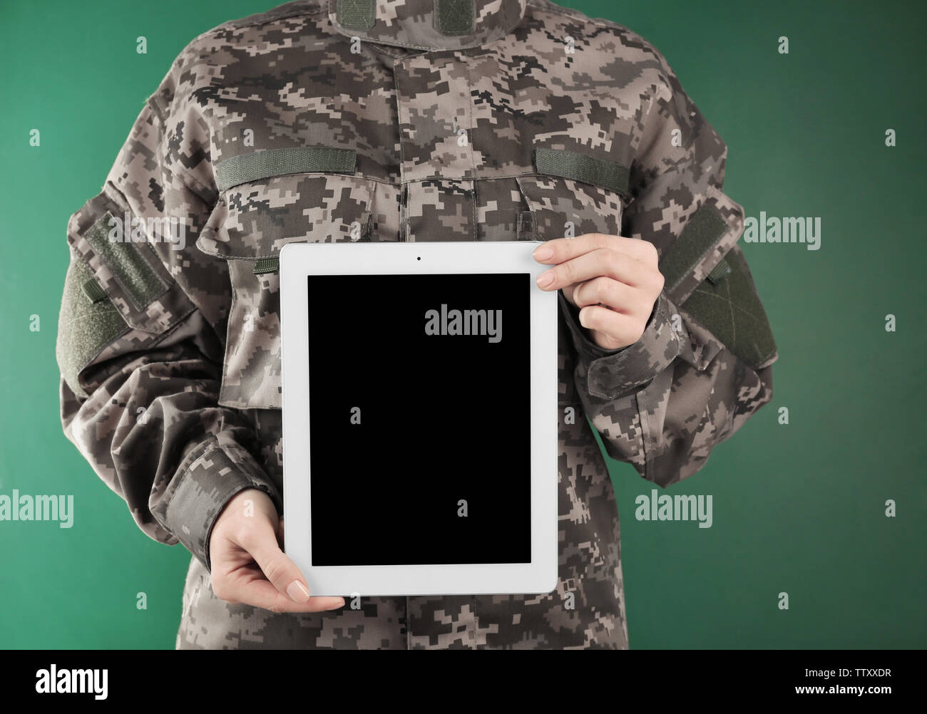 Soldier holding tablet. Military education concept Stock Photo - Alamy