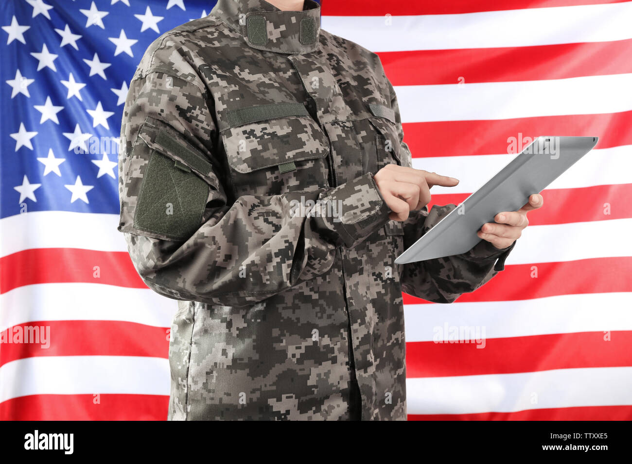 Soldier holding tablet. Military education concept Stock Photo - Alamy