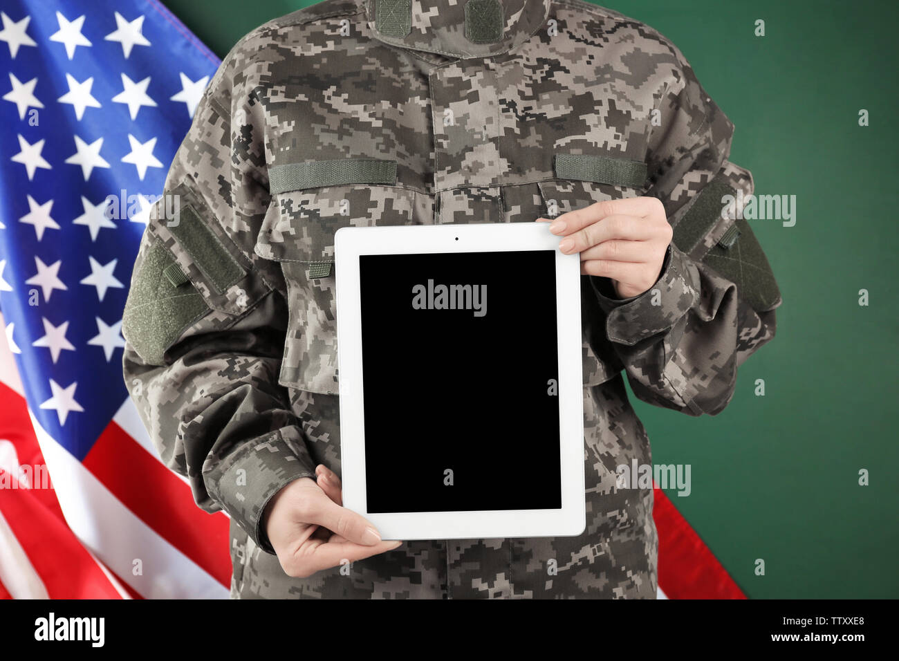 Soldier holding tablet. Military education concept Stock Photo - Alamy