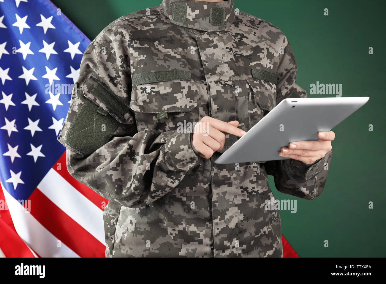 Soldier holding tablet. Military education concept Stock Photo - Alamy