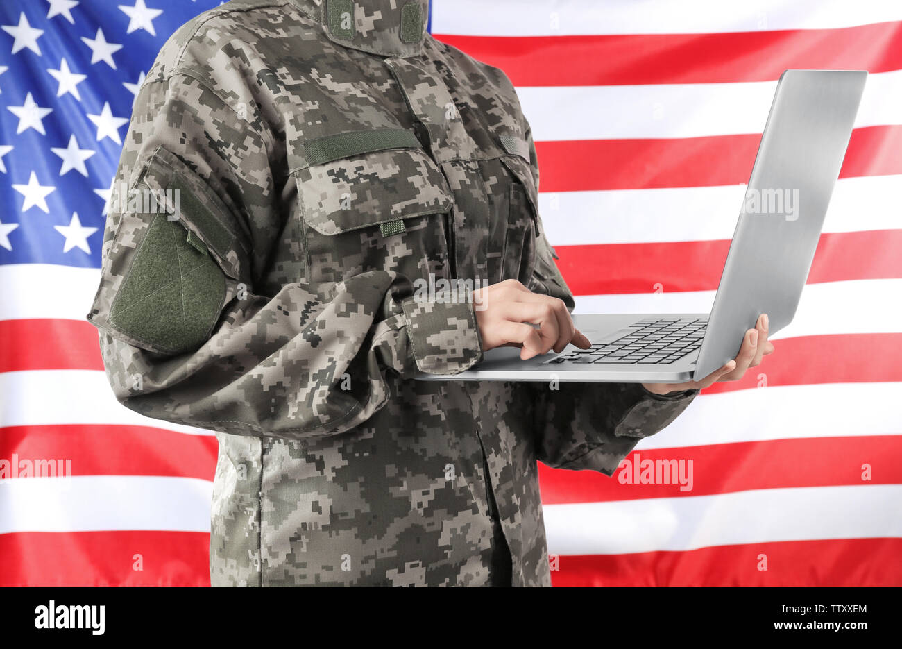 Soldier holding laptop. Military education concept Stock Photo - Alamy