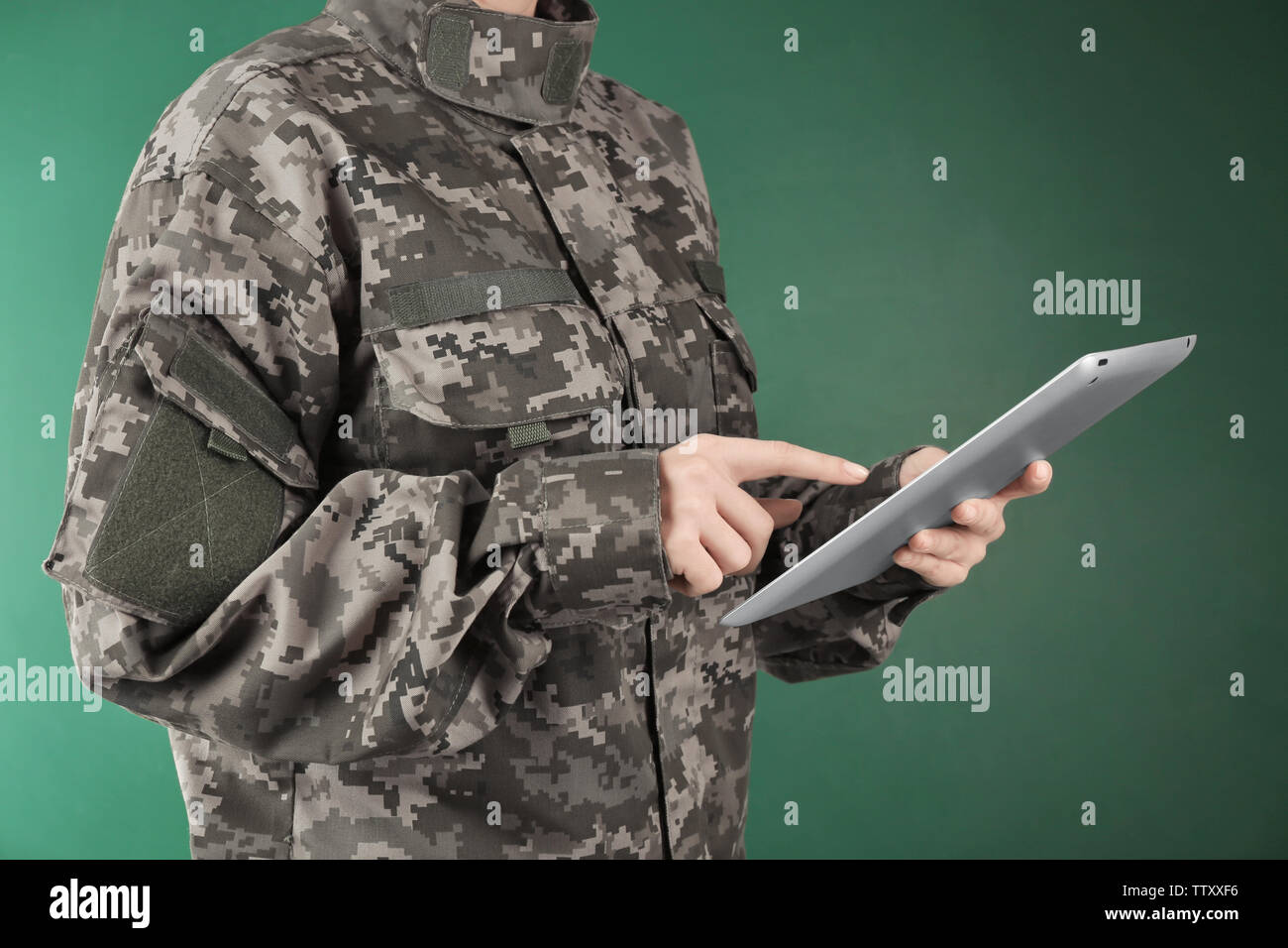 Soldier holding tablet. Military education concept Stock Photo - Alamy