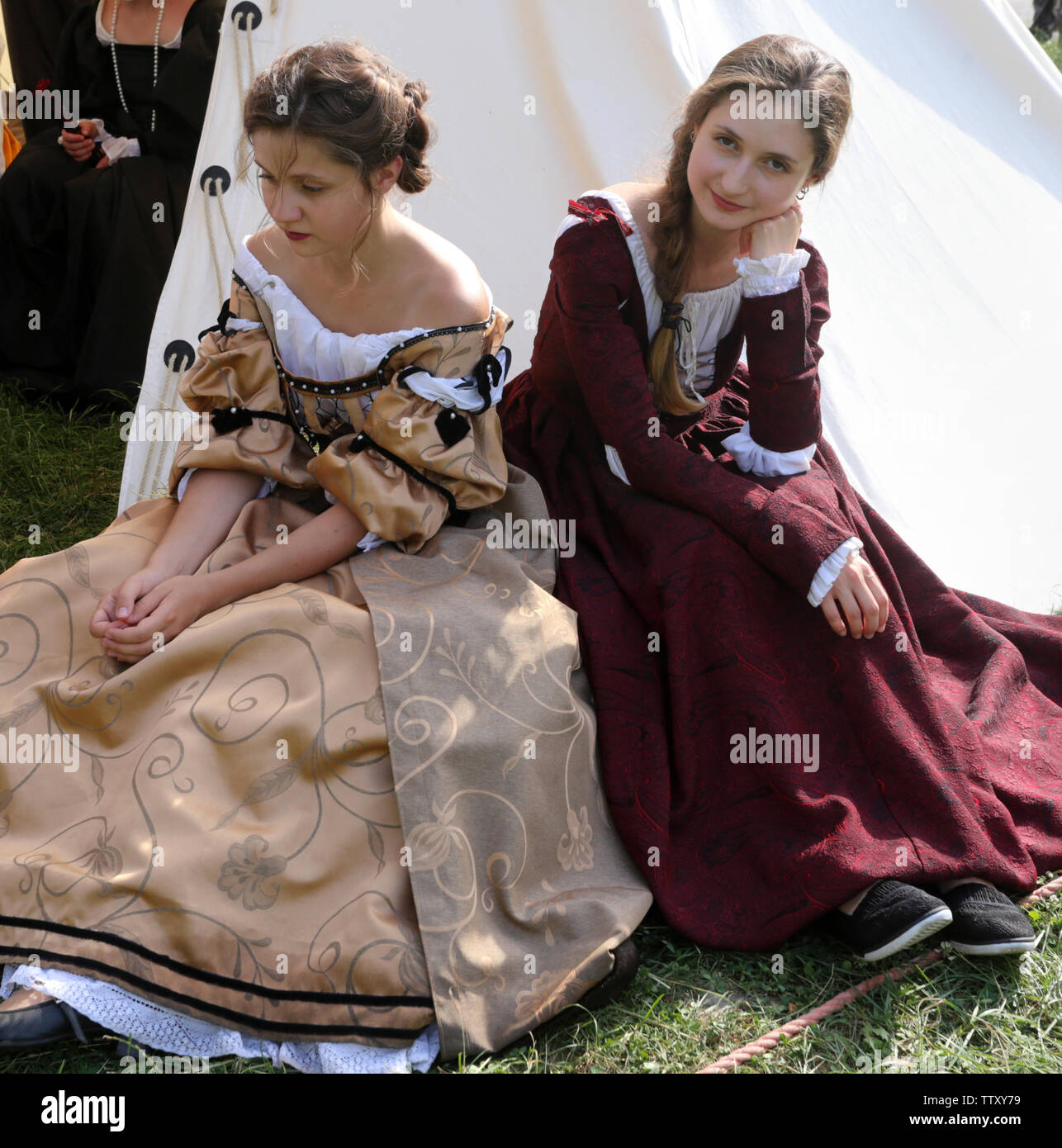 Krakow Cracow Poland. Young women dressed renaissance style resting. St ...