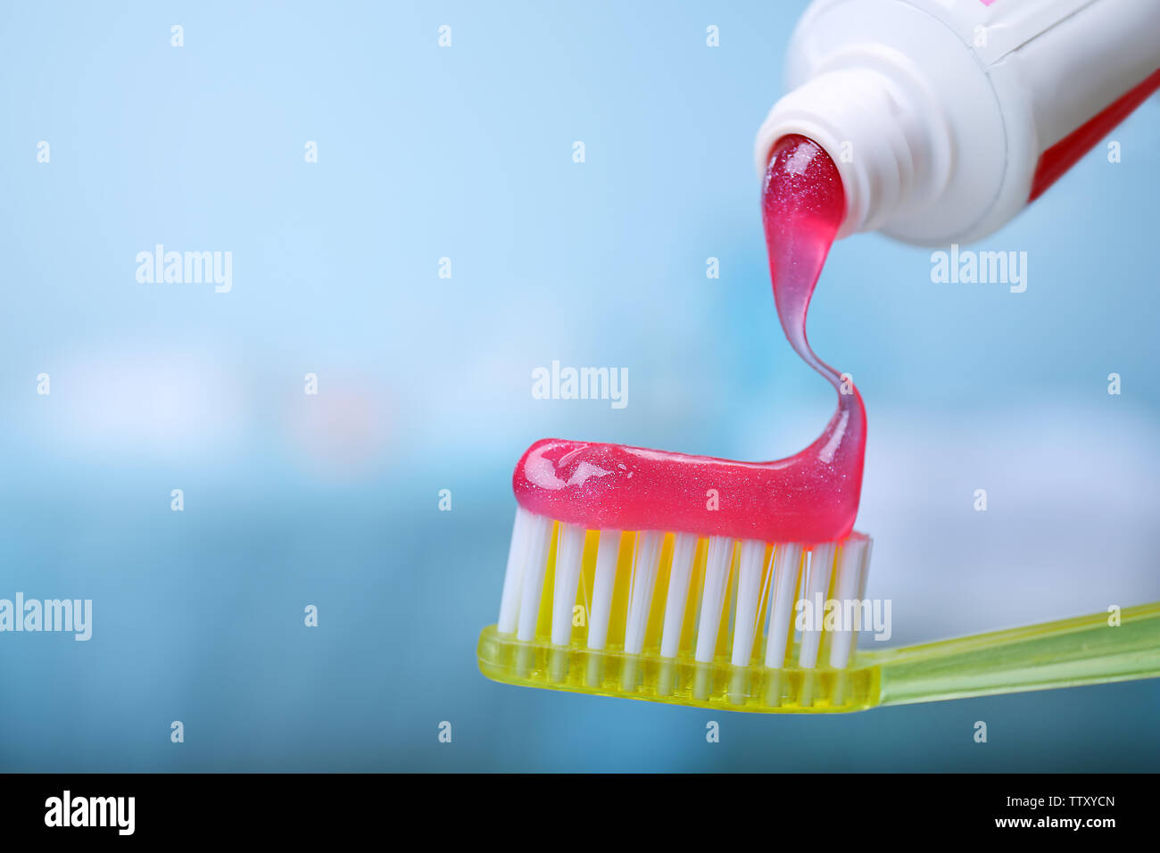Toothpaste squeezed from tube onto brush, close up Stock Photo - Alamy